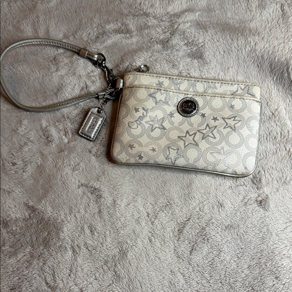 Coach | Accessories | Coach Silver Wristlet With Star Pattern | Poshmark